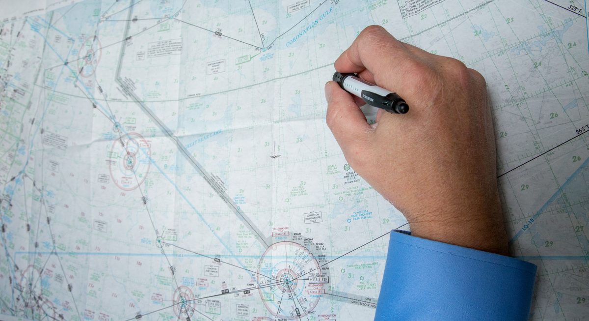 skyplan-flight-planning_5573-hand-on-map-72-dpi | Skyplan Services Limited